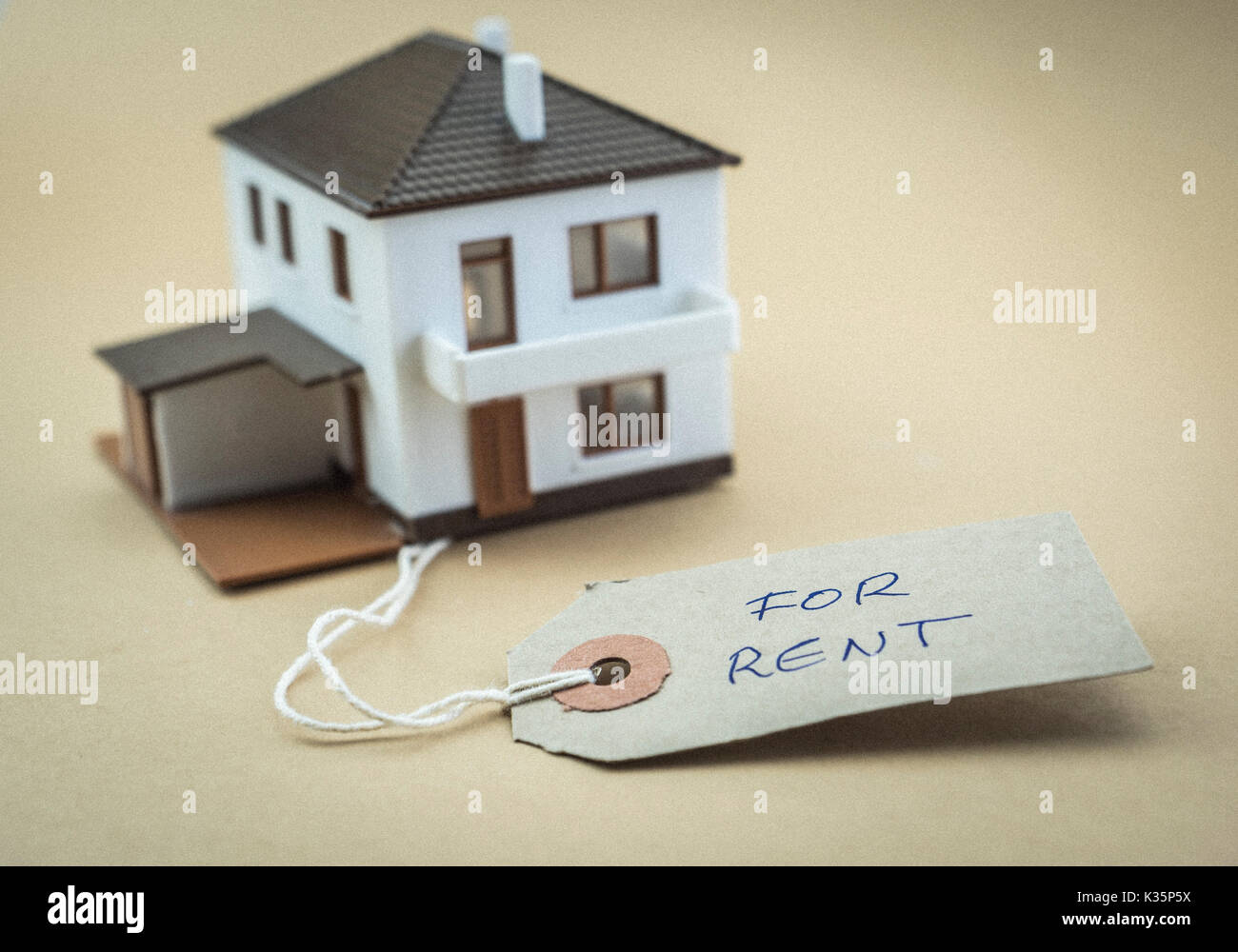 Small house with tag marked for sale Stock Photo - Alamy