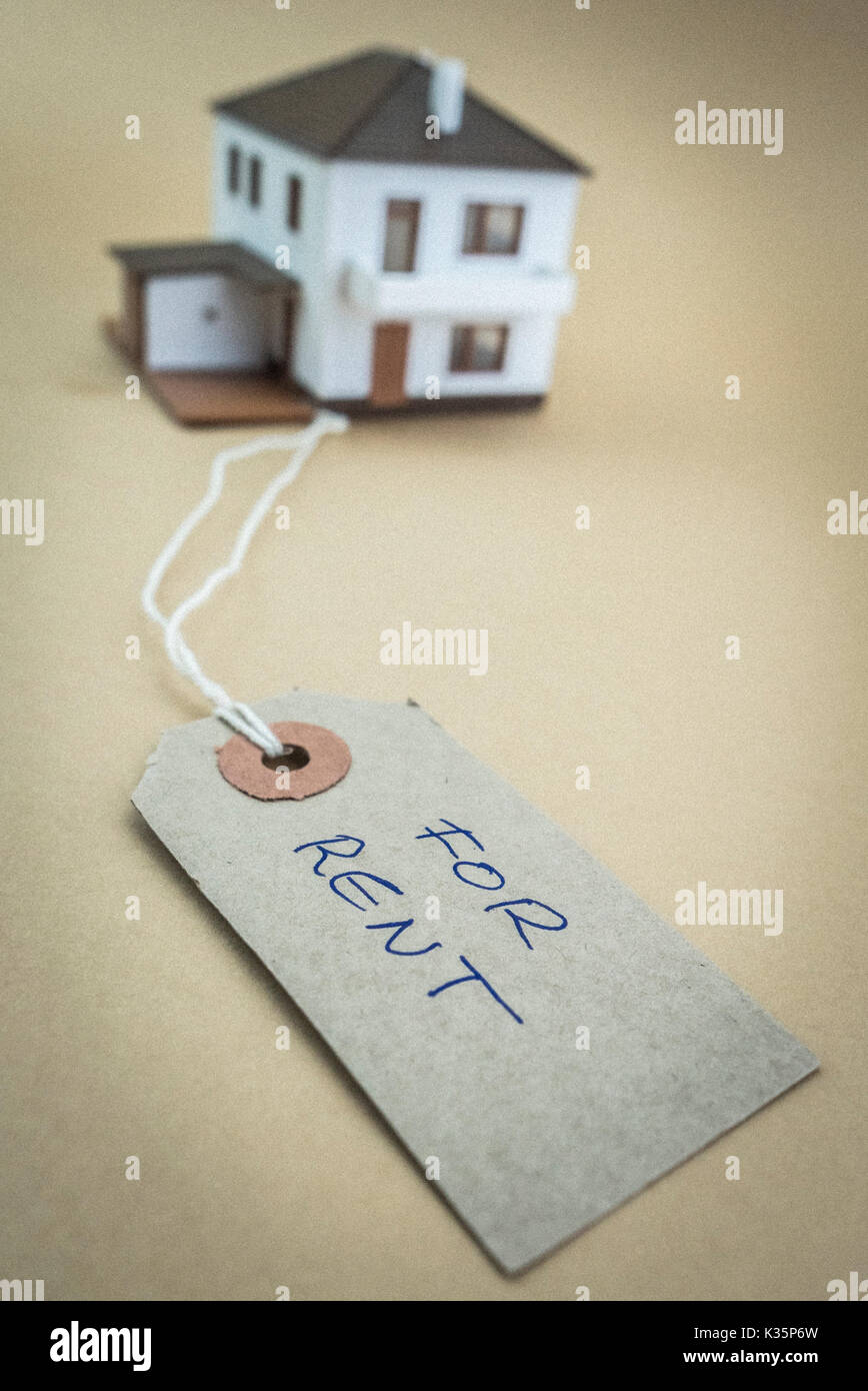Small house with tag marked for sale Stock Photo - Alamy