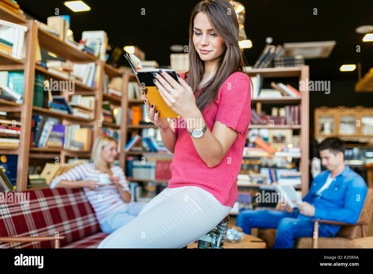 Students reading books in library Stock Photo - Alamy