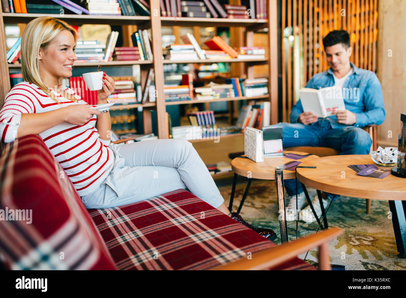 Beautiful woman relaxing after studying Stock Photo - Alamy