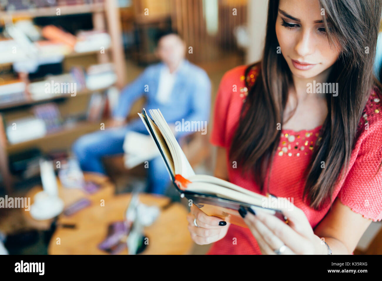 Beautiful woman reading book Stock Photo - Alamy