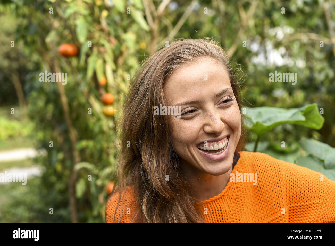 Yound woman in her garden, near Vienna, Austria (model-released Stock ...