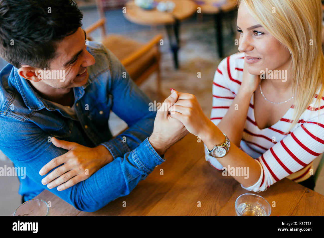 Beautiful couple in love flirting in cafe Stock Photo - Alamy