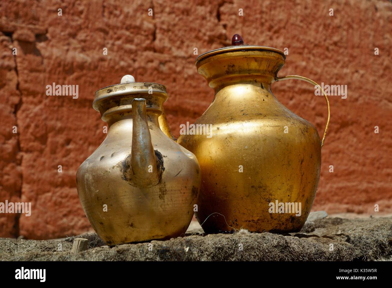 Metal water carrier jugs in Nepal Stock Photo - Alamy