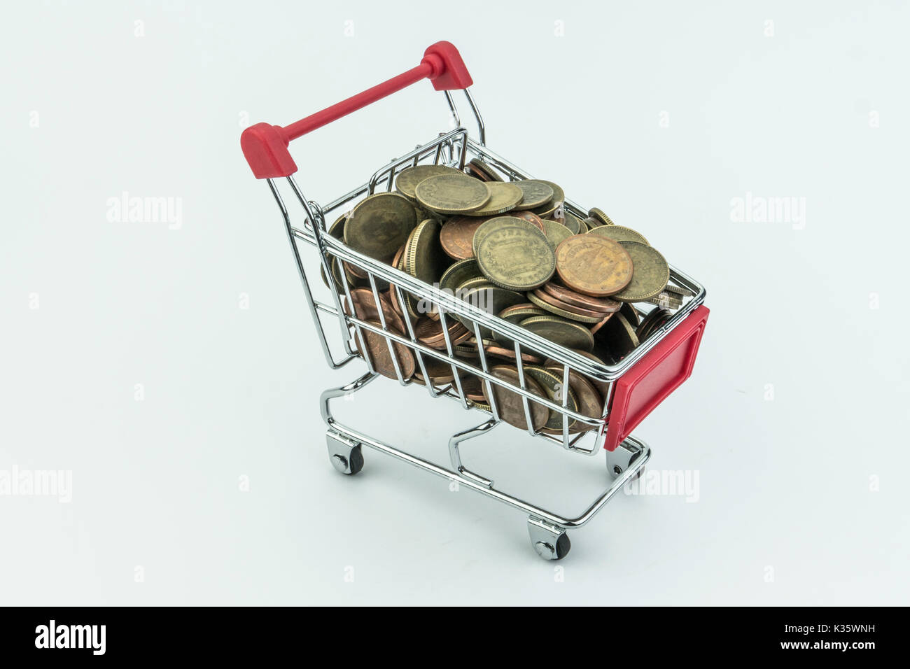 Traditional shopping cart full of coins, business concept Stock Photo ...