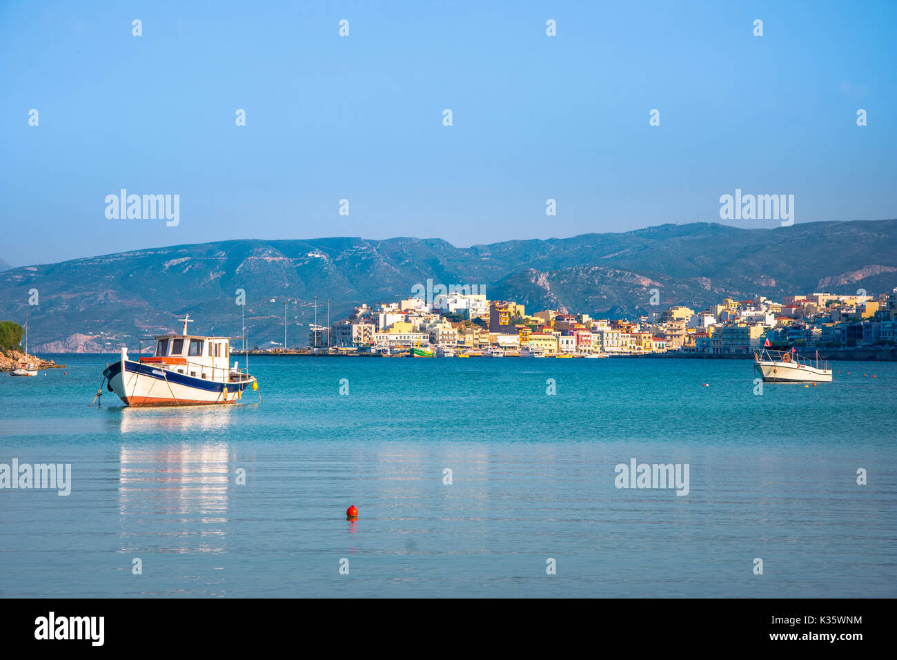 Small natural harbor with anchored fishing boats with the beautiful ...