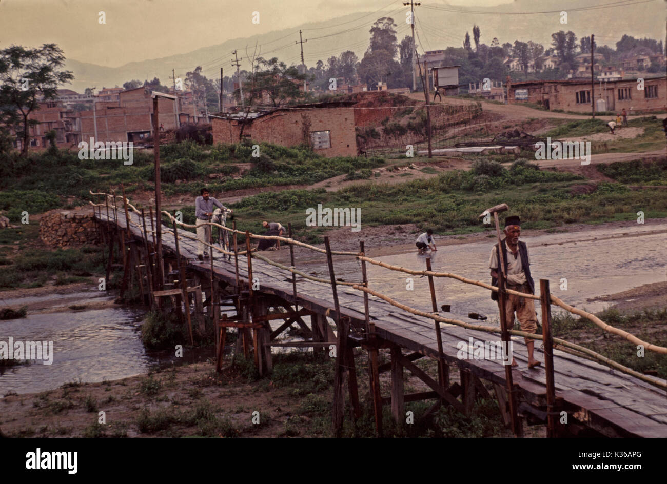 Nepal, wooden bridge Stock Photo - Alamy