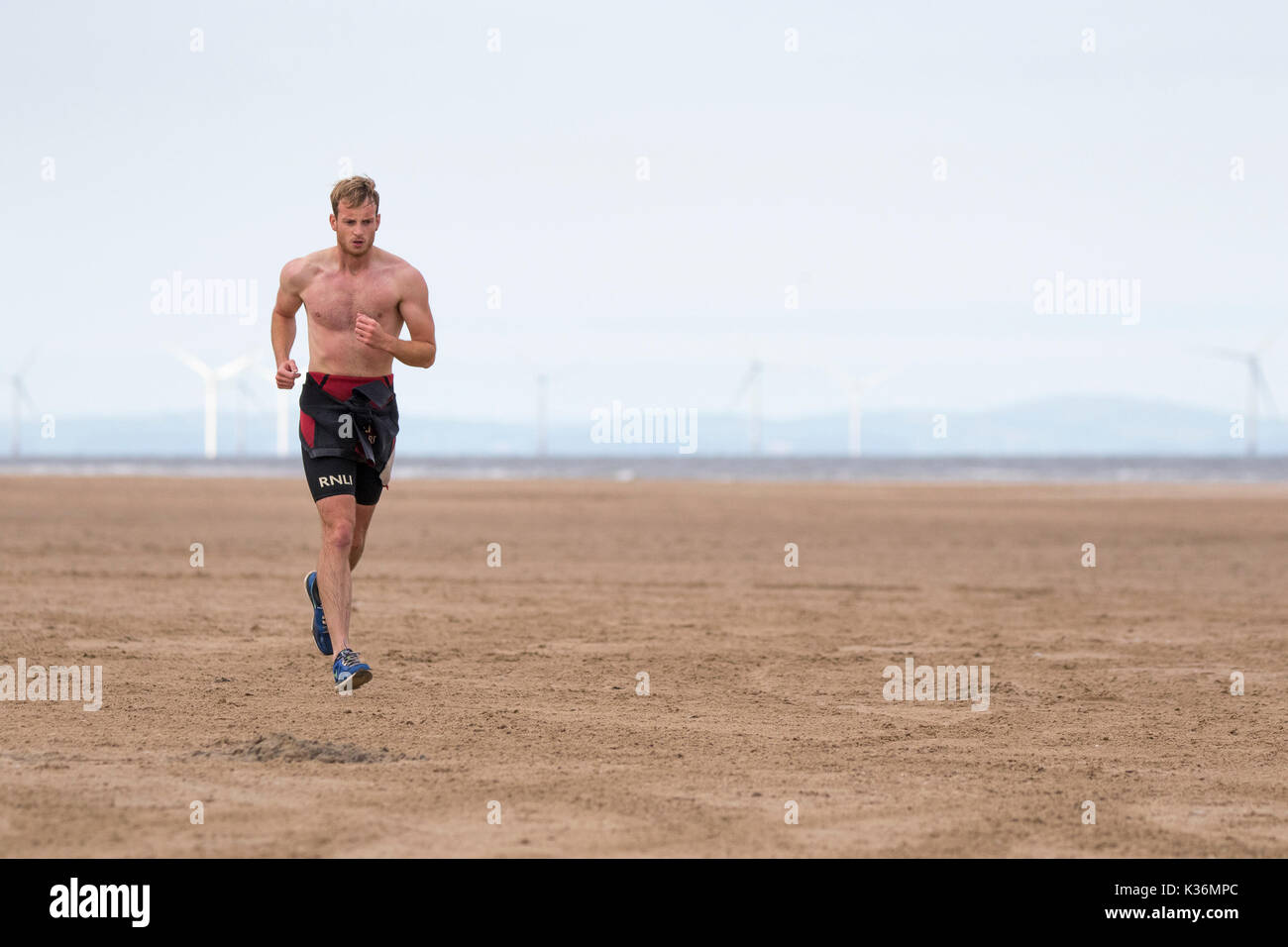 rnli lifeguard sea save rescue rescuer emergency drown drowning water ...