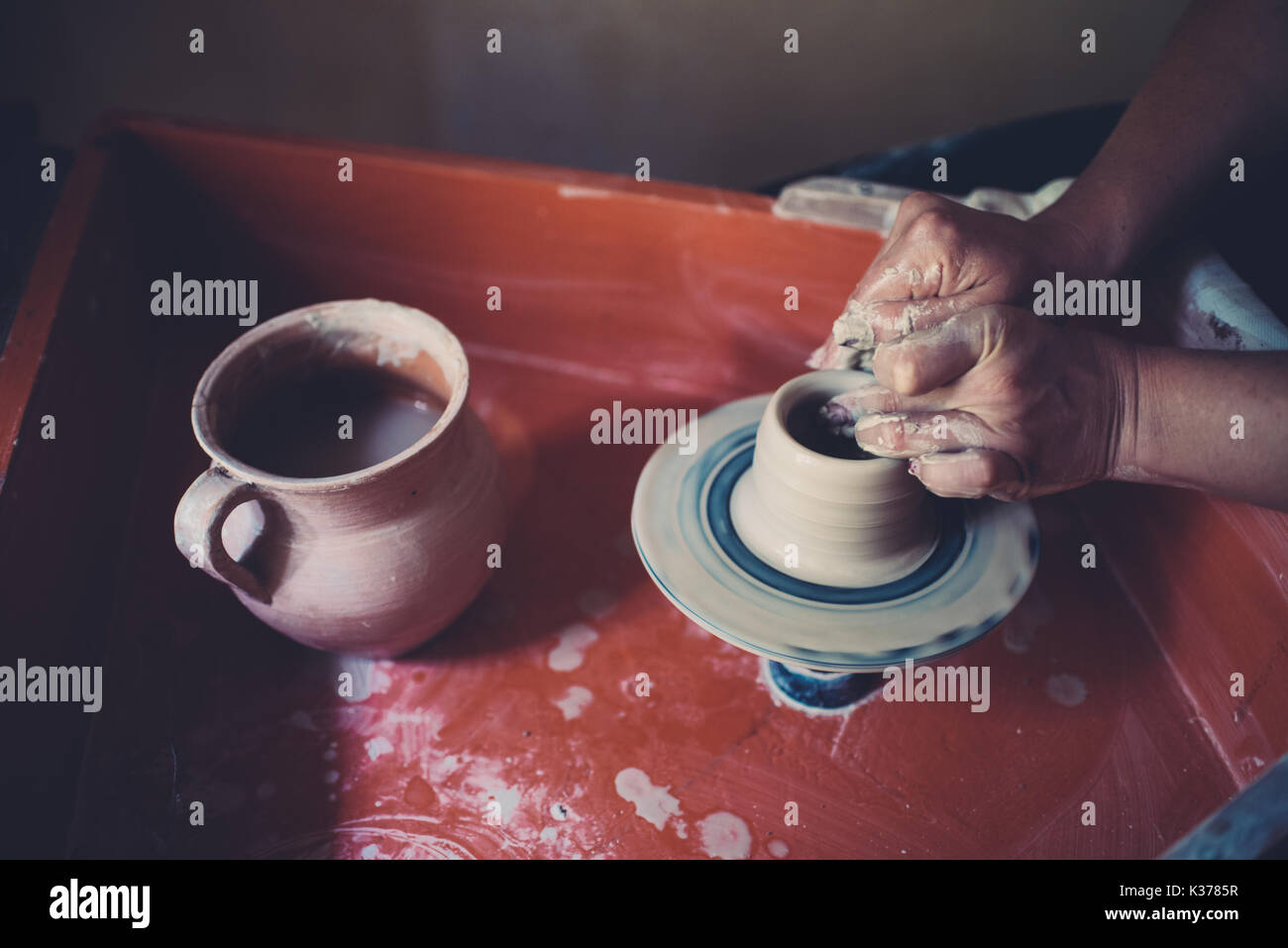 Work in a pottery workshop, womans hands creating ceramics Stock Photo ...