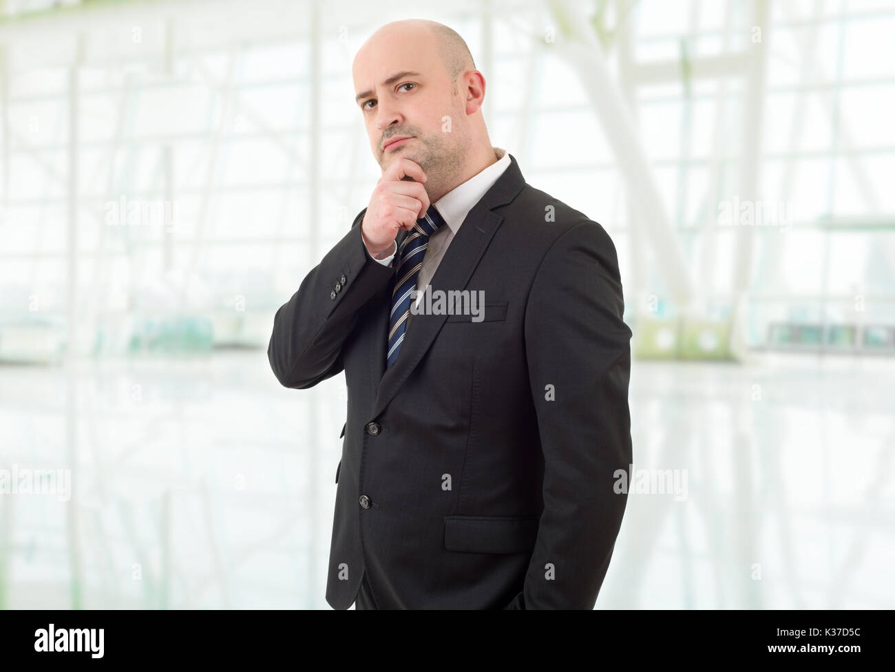 young business man thinking, at the office Stock Photo - Alamy