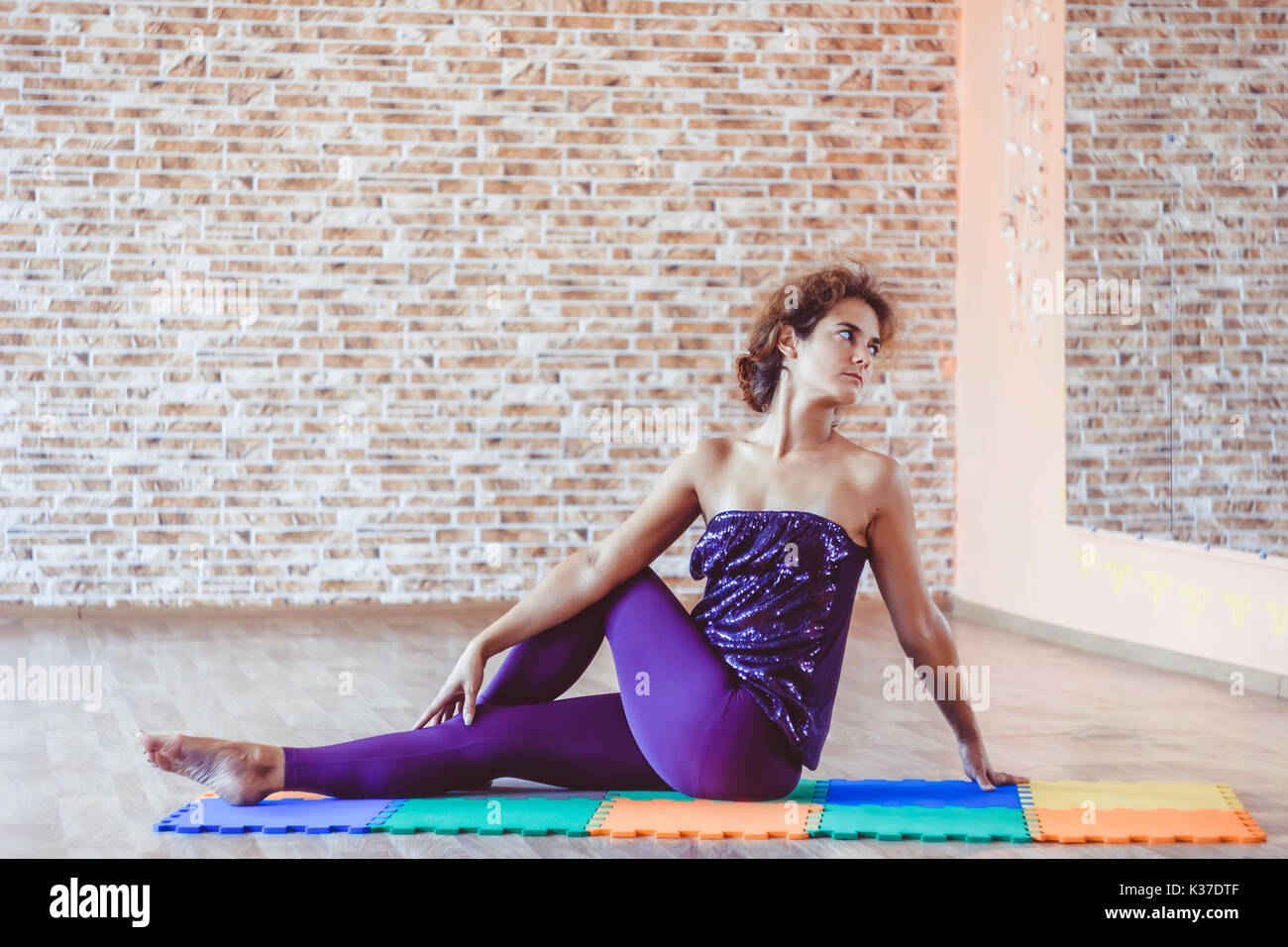 Full length side view portrait of beautiful young woman working out in ...