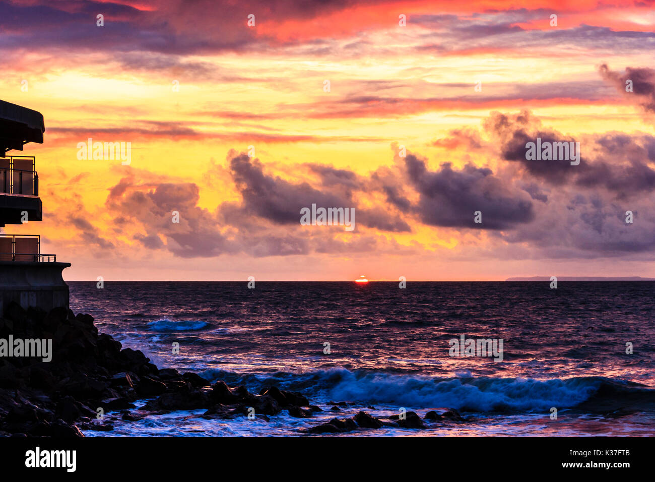 Dramatic orange, red and purple sunset over the sea at Westward Ho ...