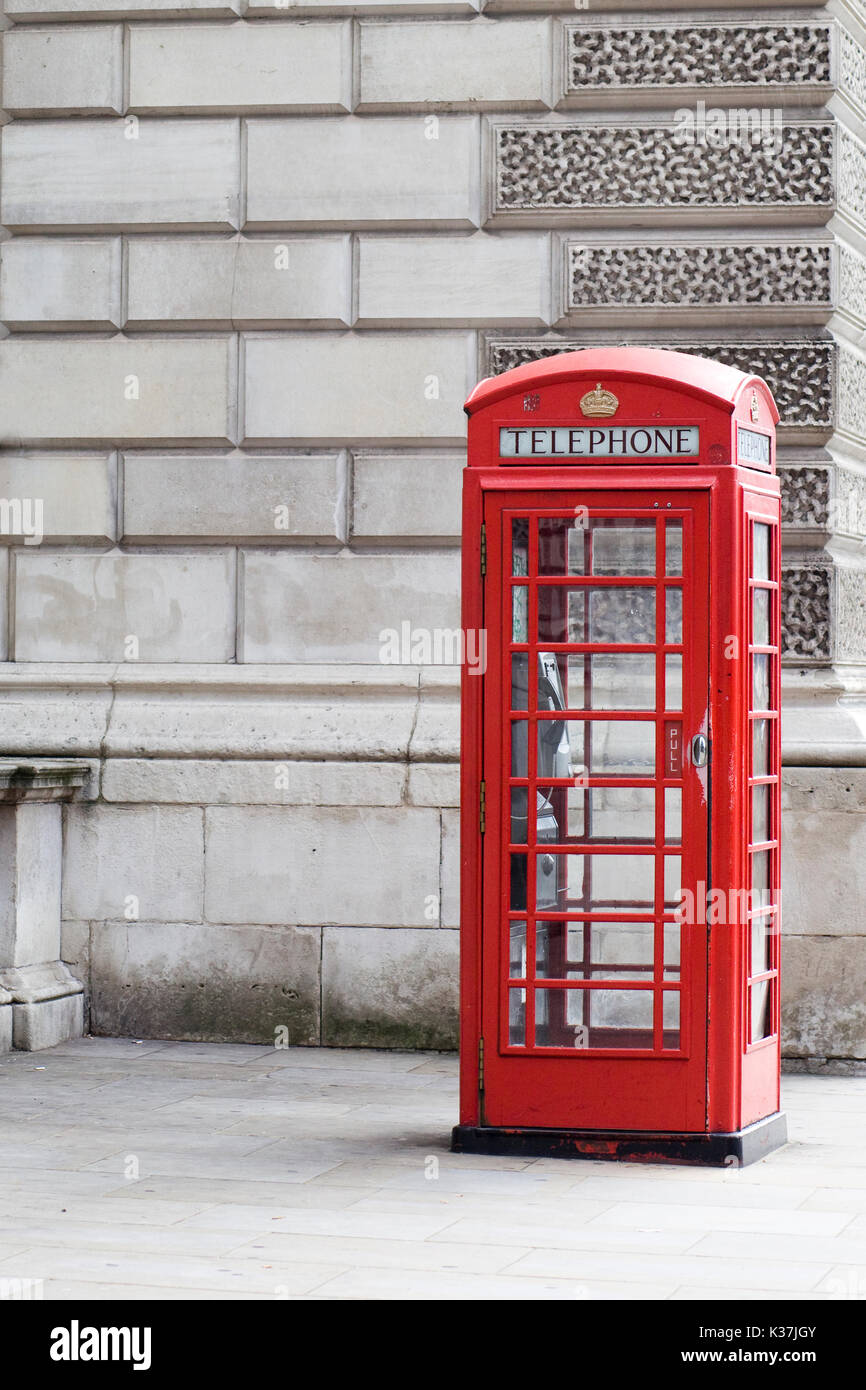 Traditional red telephone box outside the Government Treasury building ...