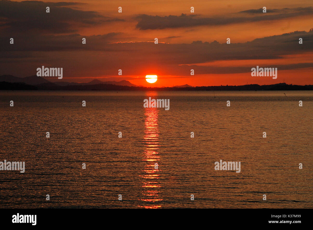 Sunset on tropical shores Stock Photo - Alamy