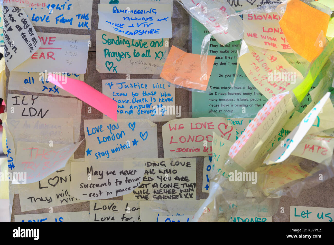Wall of condolence cards, notes, messages, tributes and flowers at ...