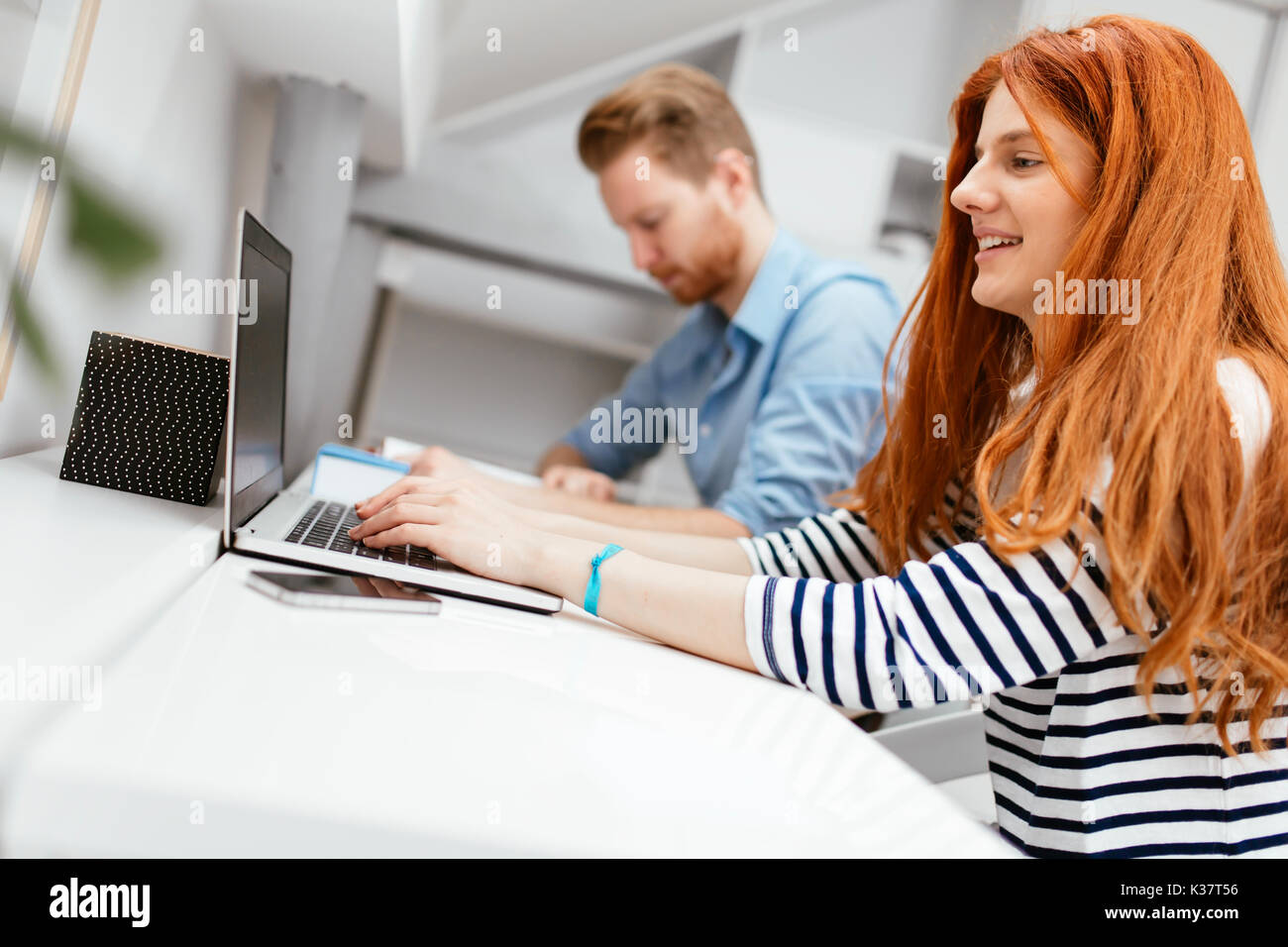 Two colleagues in office using computer hi-res stock photography and ...