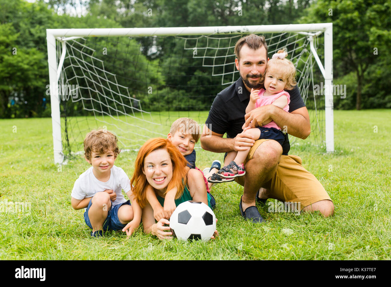 Father kids playing football together hi-res stock photography and ...