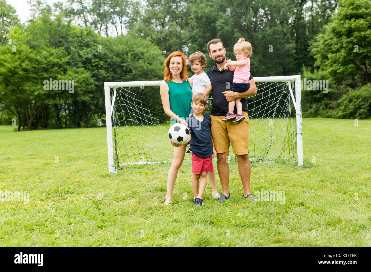 Father kids playing football together hi-res stock photography and ...