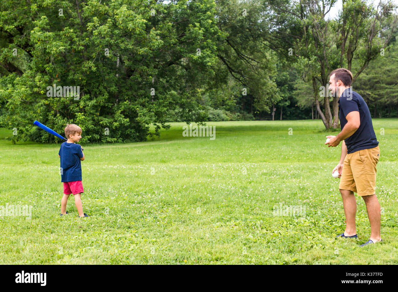 Happy father and his son playing baseball Stock Photo - Alamy