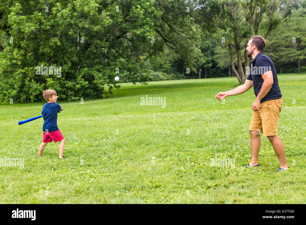 Happy father and his son playing baseball Stock Photo - Alamy