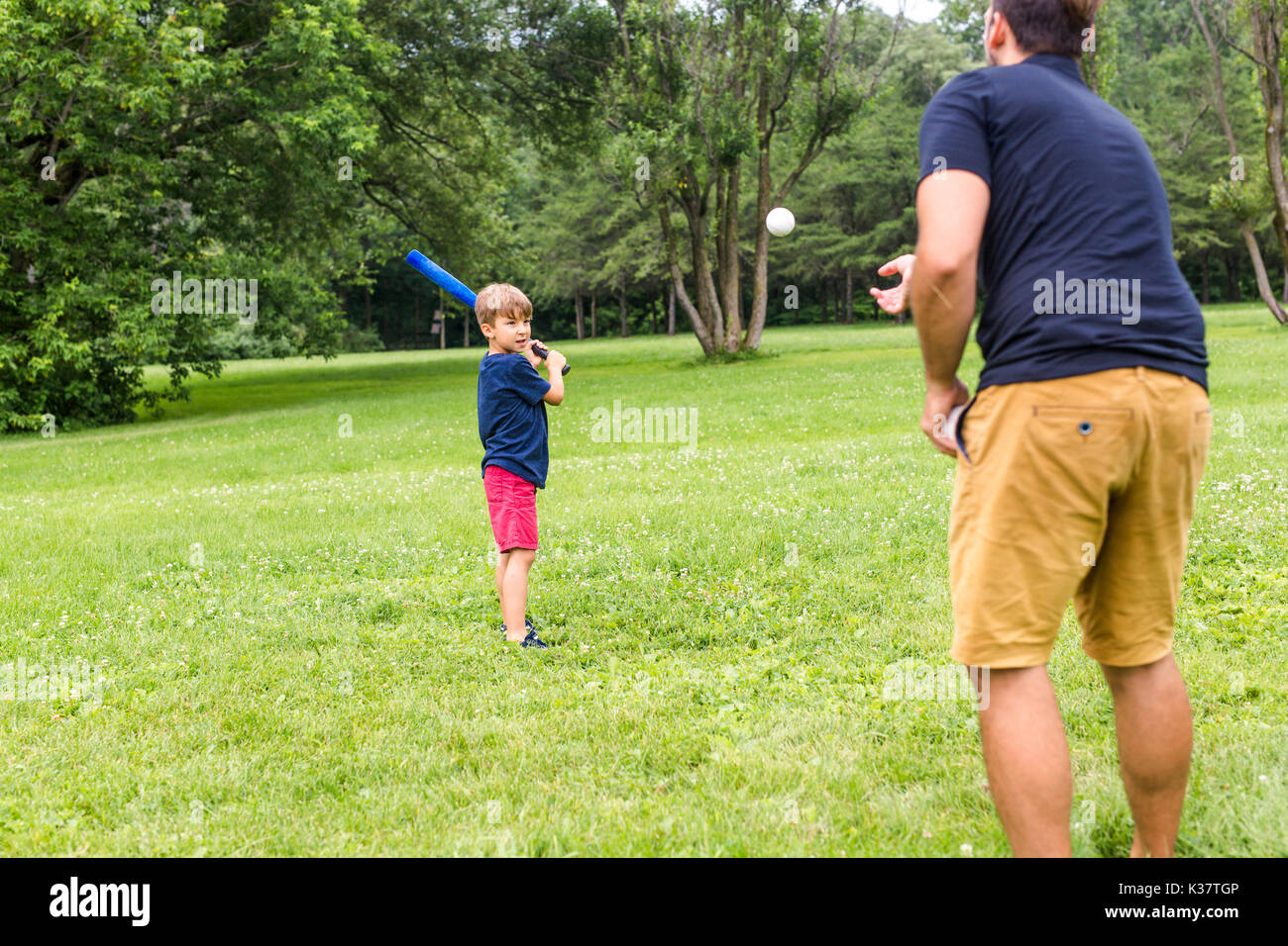 Happy father and his son playing baseball Stock Photo - Alamy