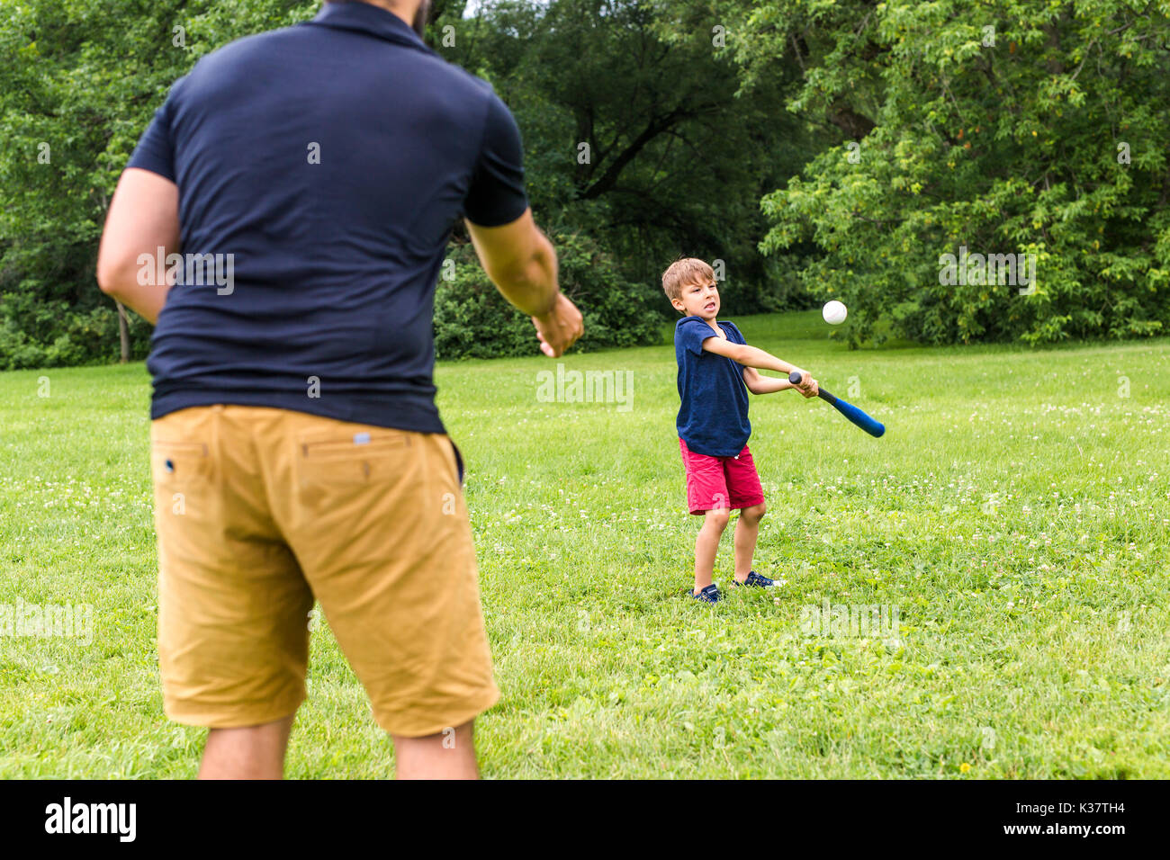 Happy father and his son playing baseball Stock Photo - Alamy