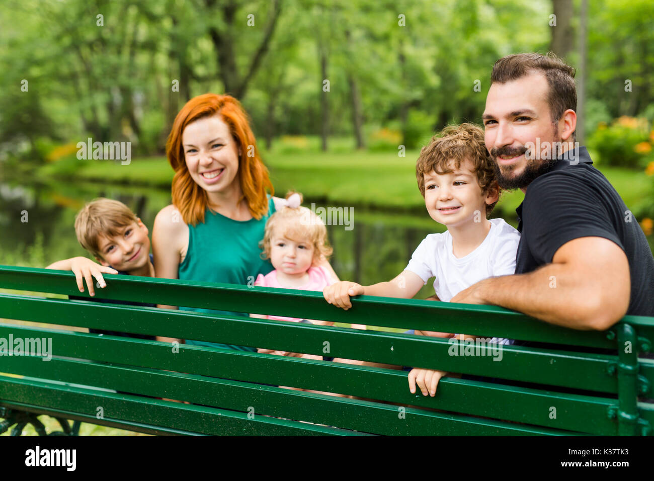 Redhead girl sitting on bench hi-res stock photography and images - Alamy