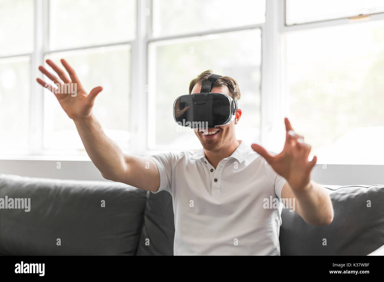 Handsome man wearing vr headset hi-res stock photography and images - Alamy