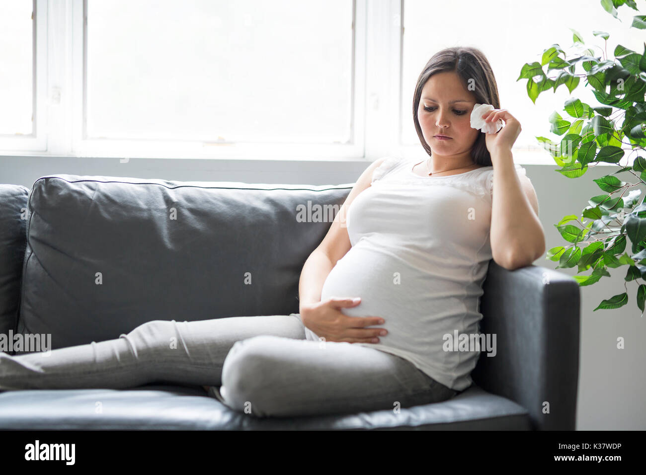 Sad pregnant woman hi-res stock photography and images - Alamy