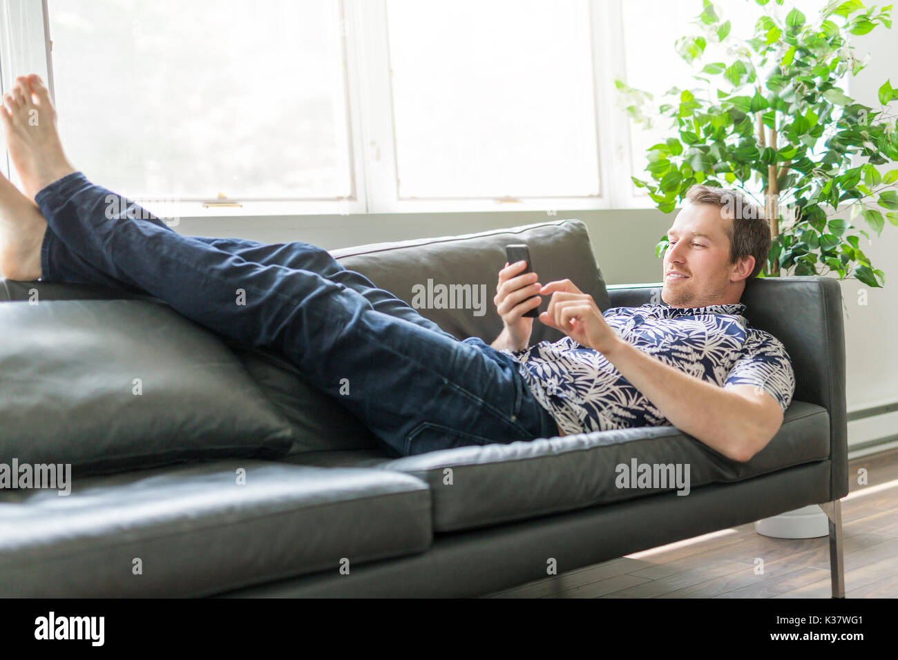 Attractive man using cell telephone hi-res stock photography and images ...