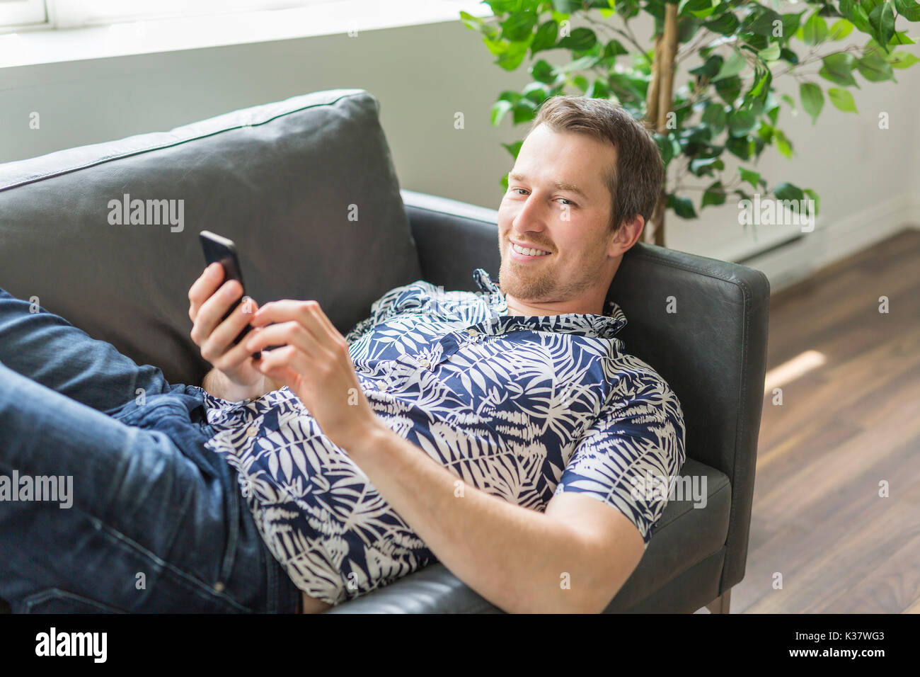 Attractive man using cell telephone hi-res stock photography and images ...