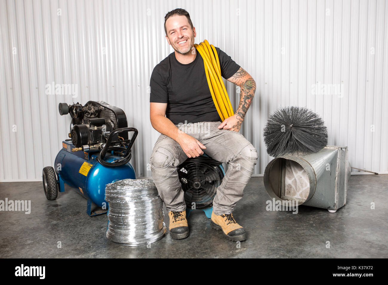 ventilation cleaner man at work with tool Stock Photo - Alamy