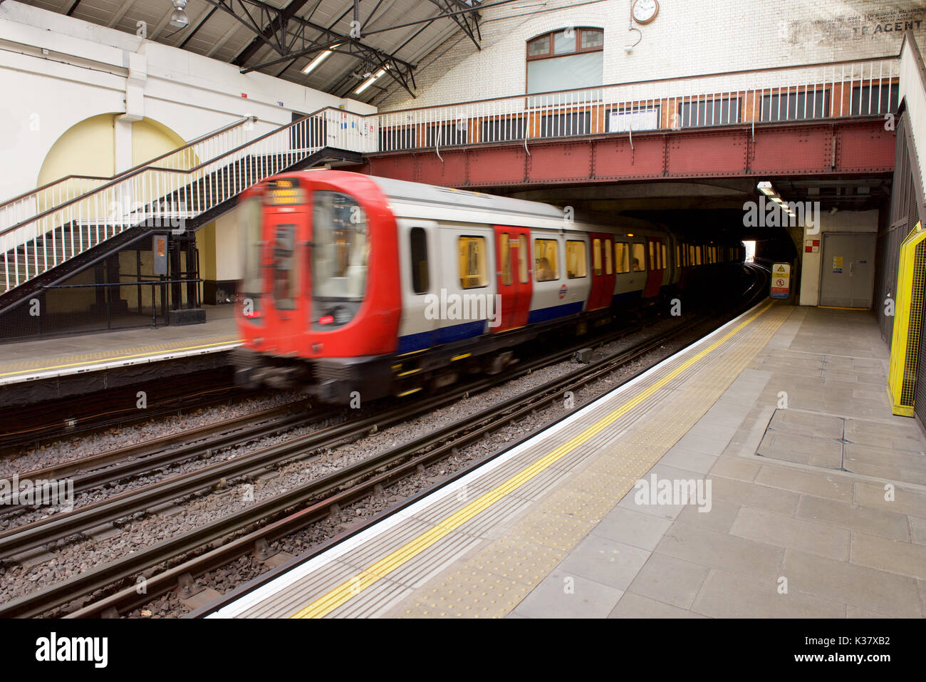 District Line train at Fulham Broadway Underground station in London ...
