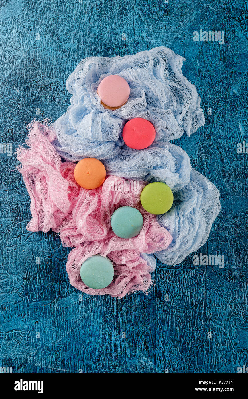 Classic French macaroon cookies on blue background Stock Photo - Alamy