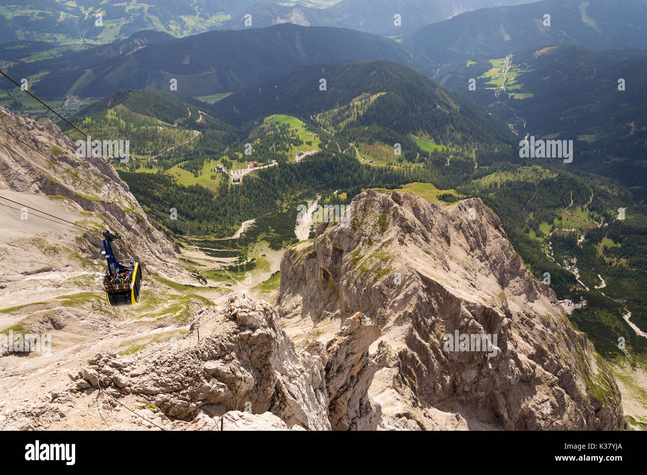 RAMSAU AM DACHSTEIN, AUSTRIA - AUGUST 17: Tourists on top of gondola in ...