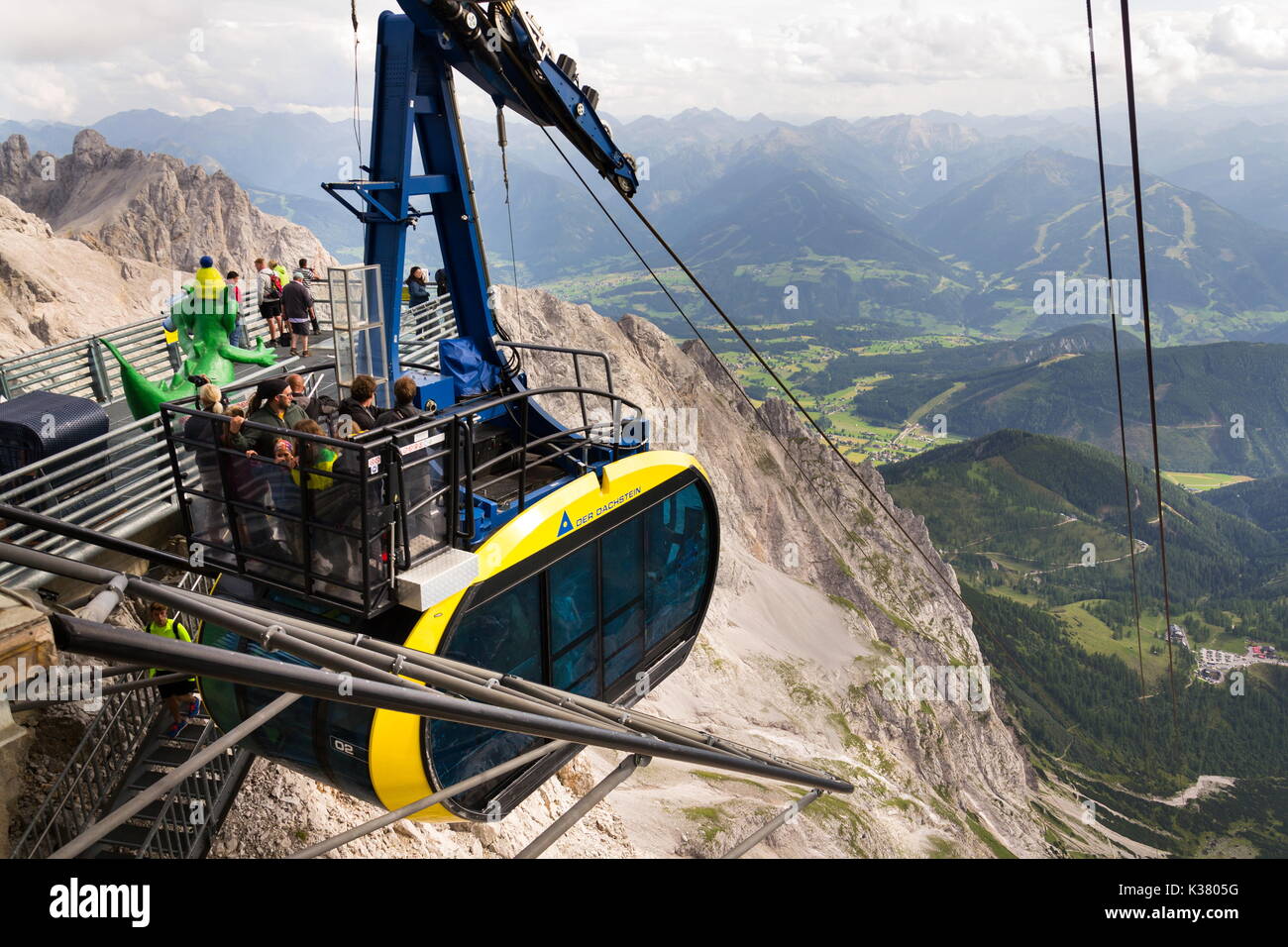 RAMSAU AM DACHSTEIN, AUSTRIA - AUGUST 17: Tourists on top of gondola in ...
