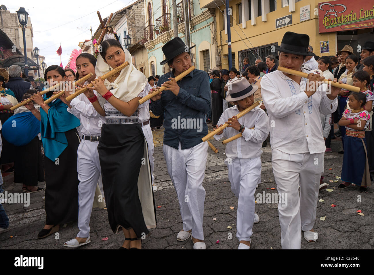 April 14, 2017 Cotacachi,Ecuador: indigenous quechua playing flute made ...