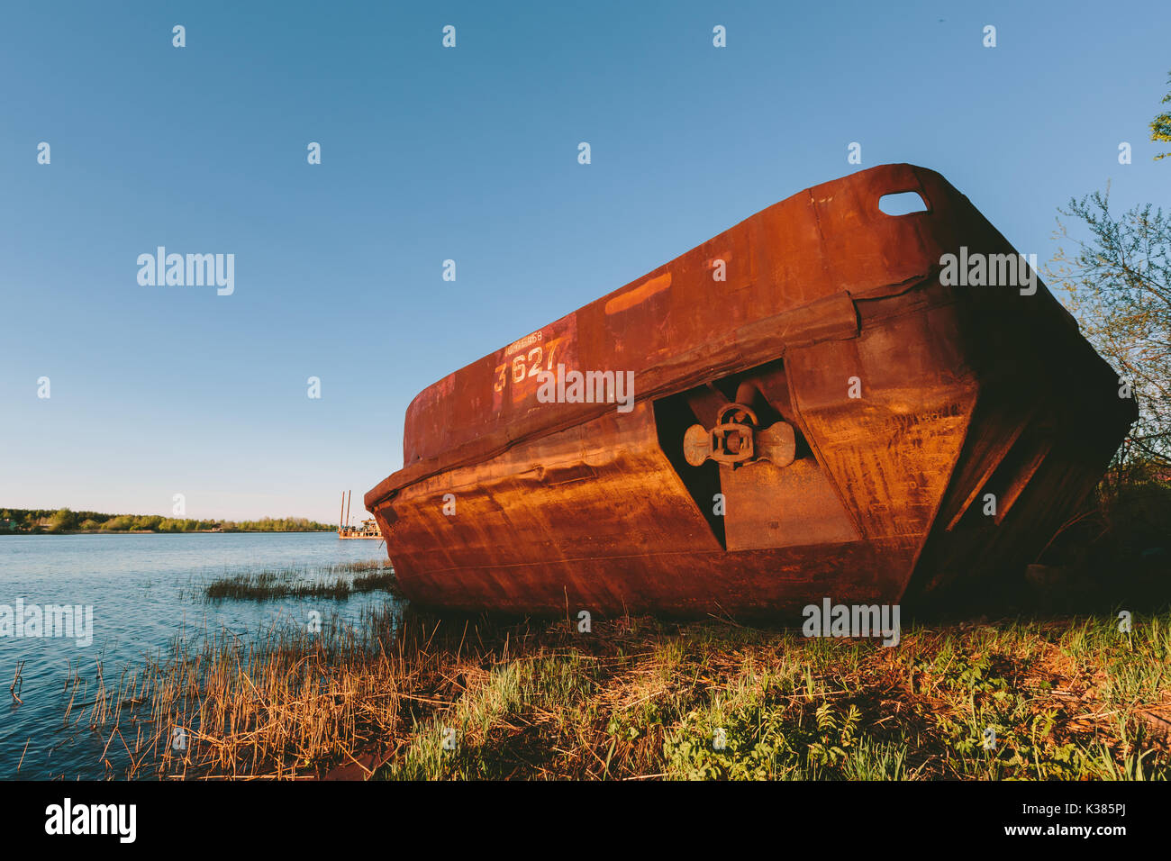 Old rusty ship on the river bank Stock Photo - Alamy