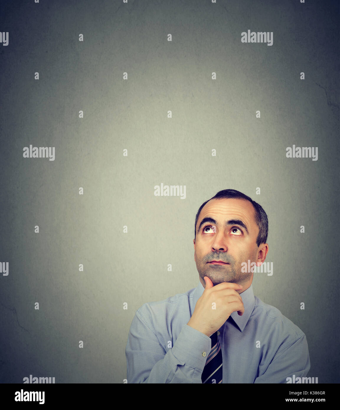 Serious mature businessman thoughtful expression hi-res stock ...