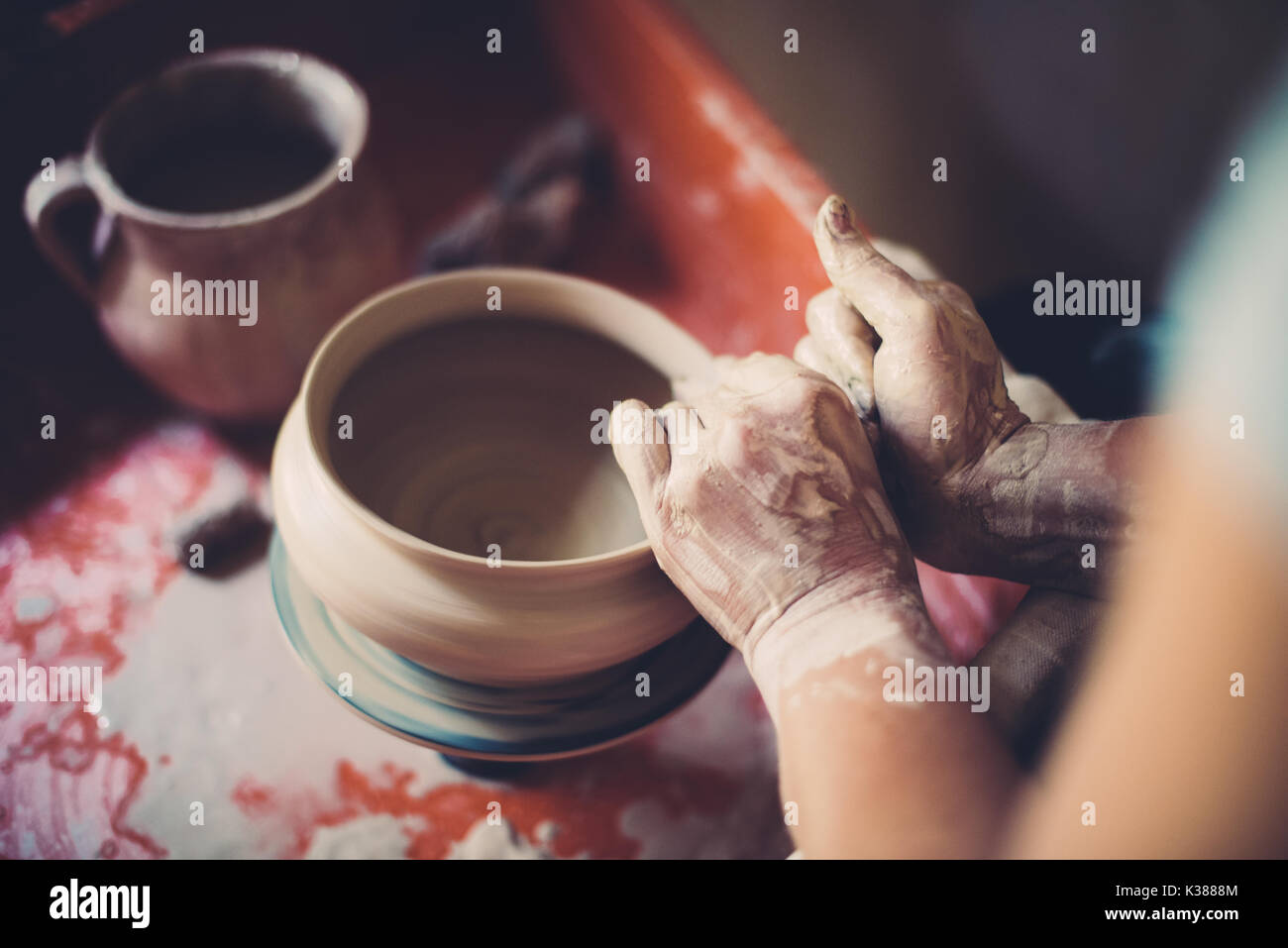 Work in a pottery workshop, womans hands creating ceramics Stock Photo ...