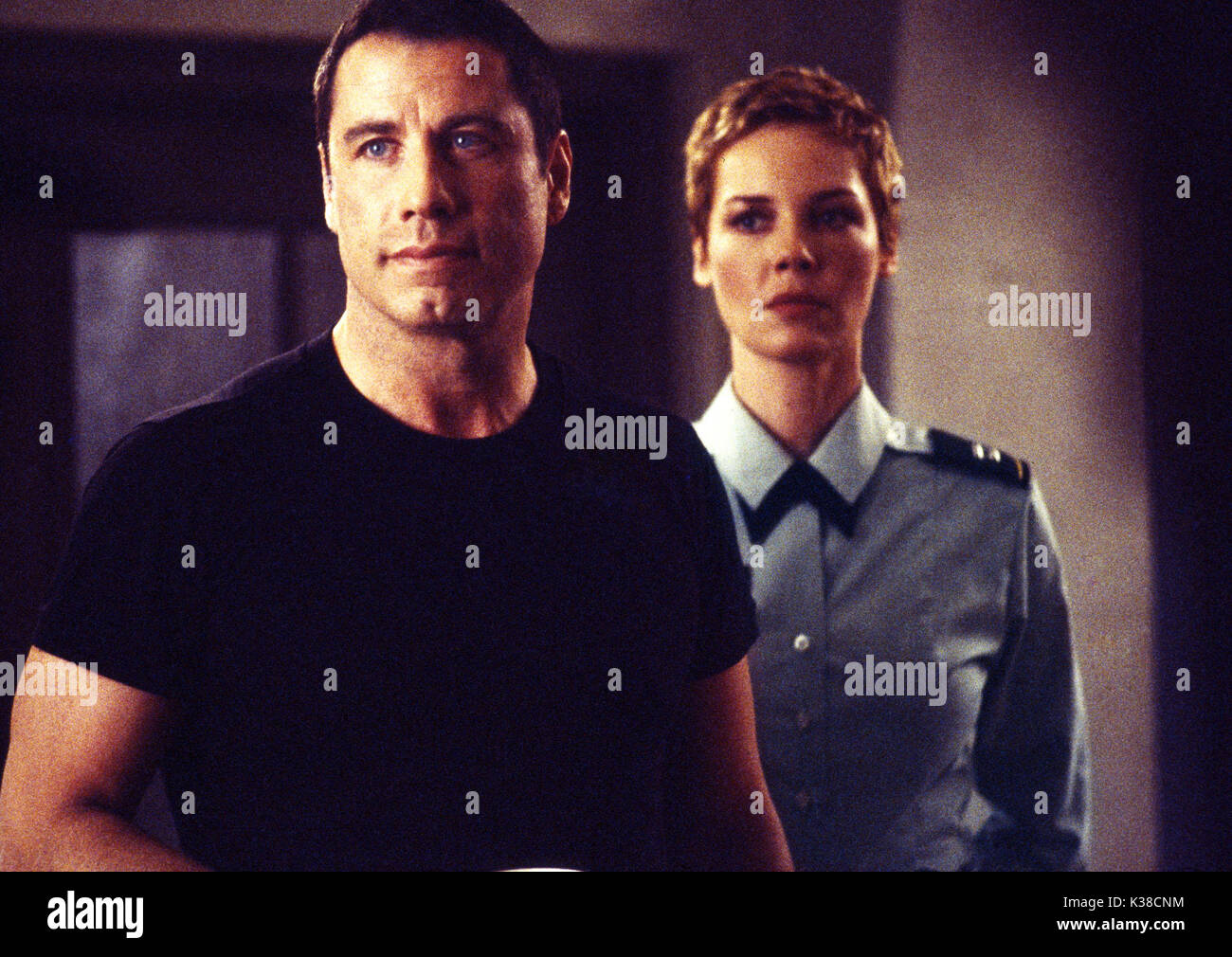 BASIC JOHN TRAVOLTA AND CONNIE NIELSEN Date: 2003 Stock Photo - Alamy