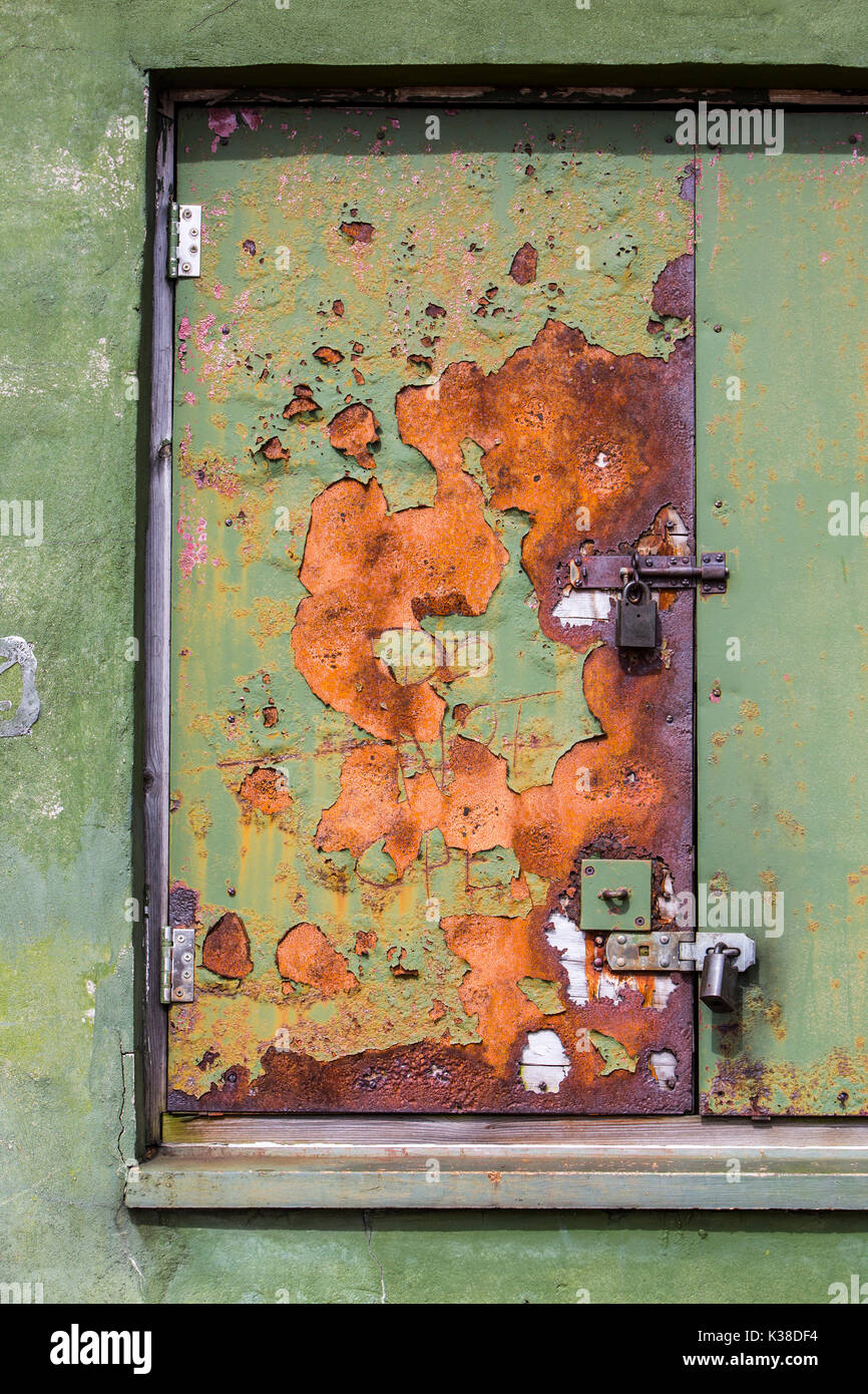 Rusty locked metal door Stock Photo - Alamy