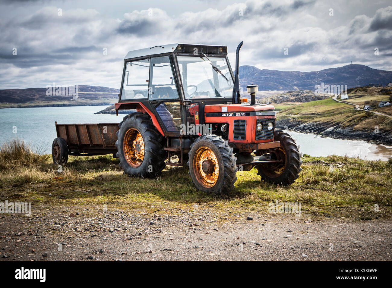 Old Zetor Tractor with a small trailer near a Loch in Scotland Stock ...