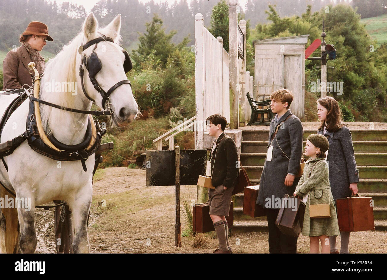 Pictured l-r: Mrs. Macready greets the children, Edmund (SKANDAR KEYNES ...