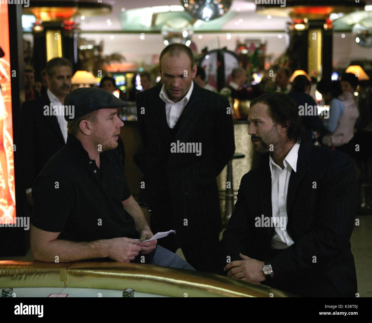 REVOLVER Director GUY RITCHIE , JASON STATHAM [right] Date: 2005 Stock ...