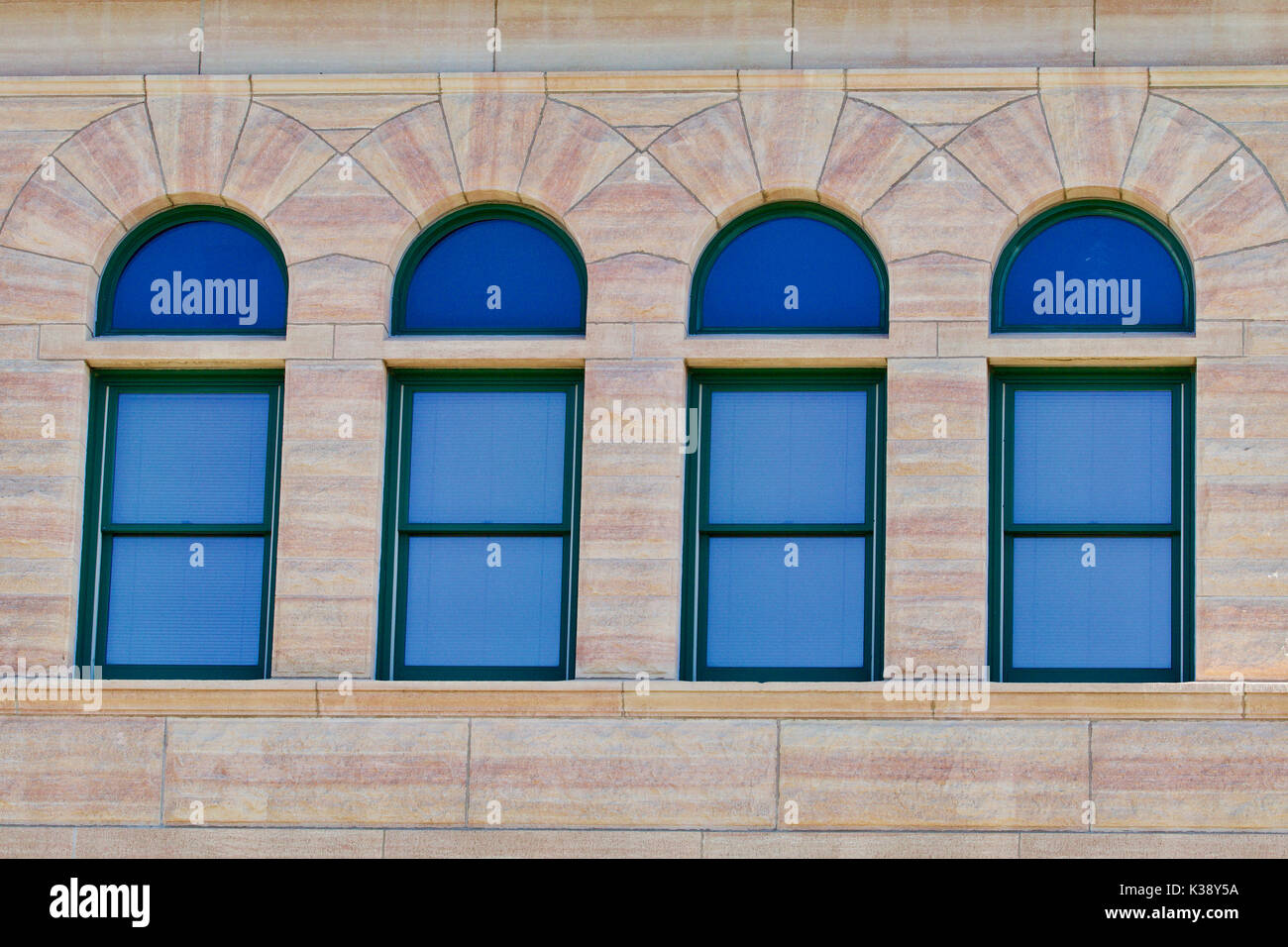 Four antique windows in a limestone building Stock Photo - Alamy