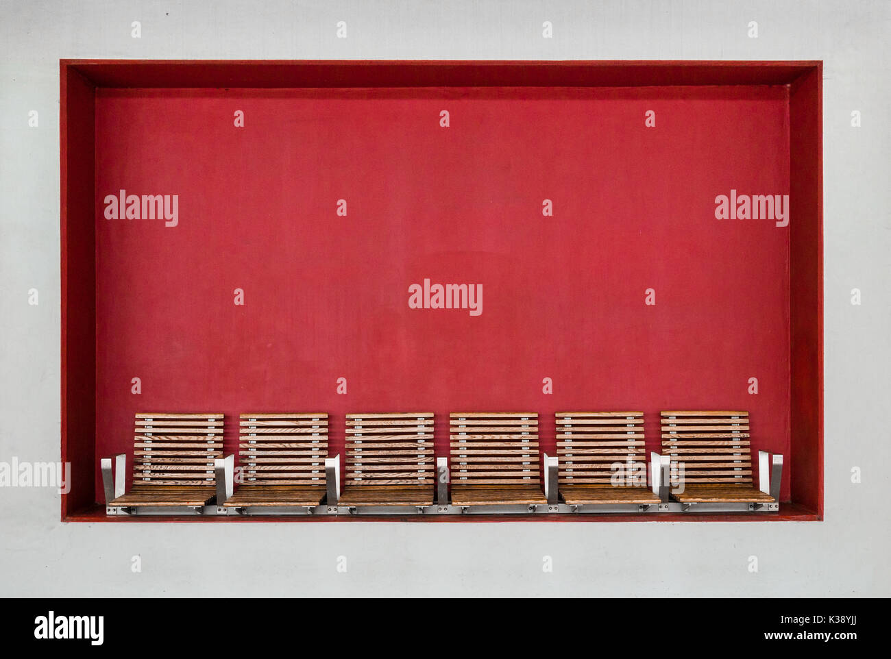 Row of wooden seats in a modern minimalist building. Minimalist ...