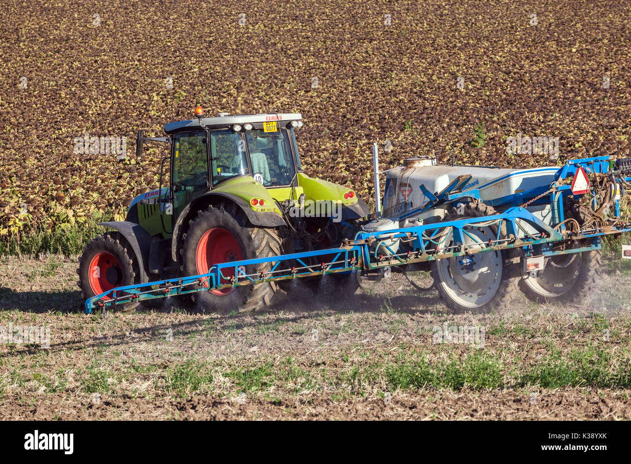 Tractor Claas Spraying crops field, Czech Republic Farmer Stock Photo ...