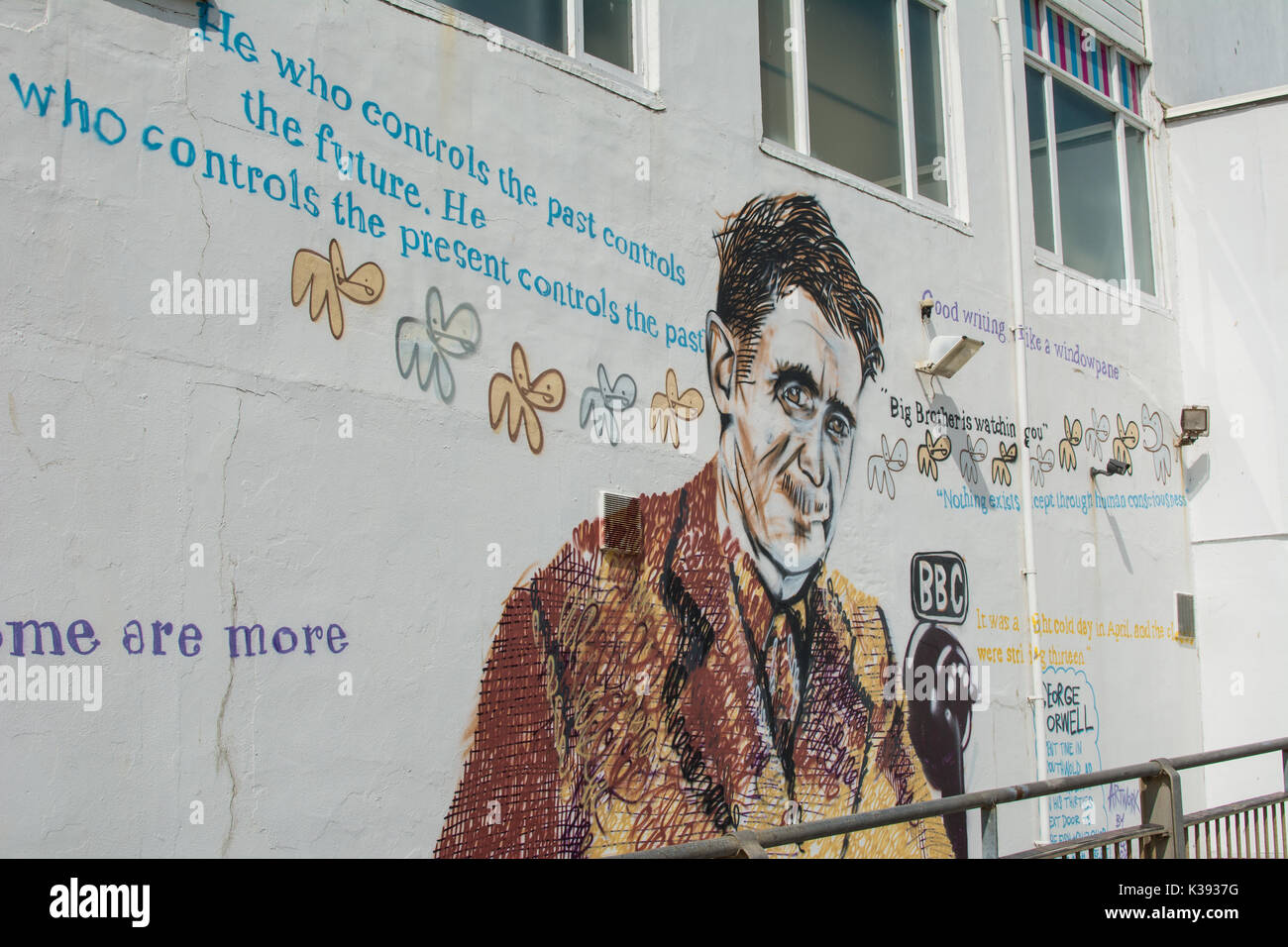 Southwold UK art on a wall BBC presenter moustache jacket brown ...