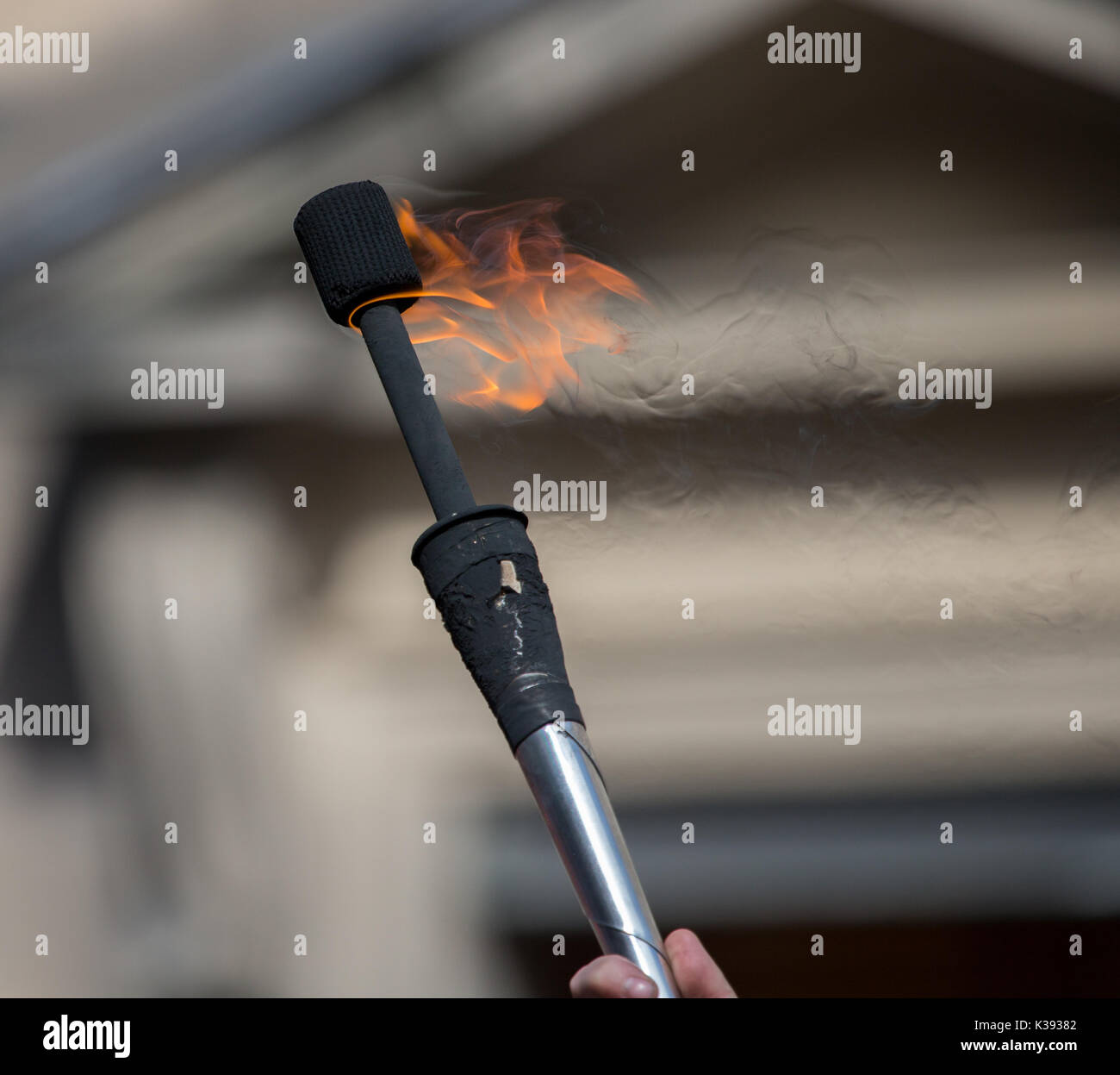 A flaming torch thrown by a fire juggler during the Edinburgh Festival ...